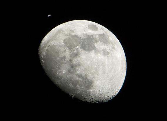 Two Moons: Photograph of the International Space Station near the Moon.