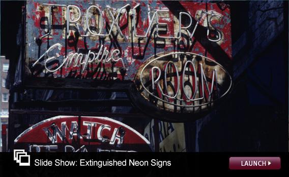 Photographs of broken neon signs.