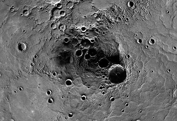 Mercury has ice buried beneath its surface in craters at its north pole
