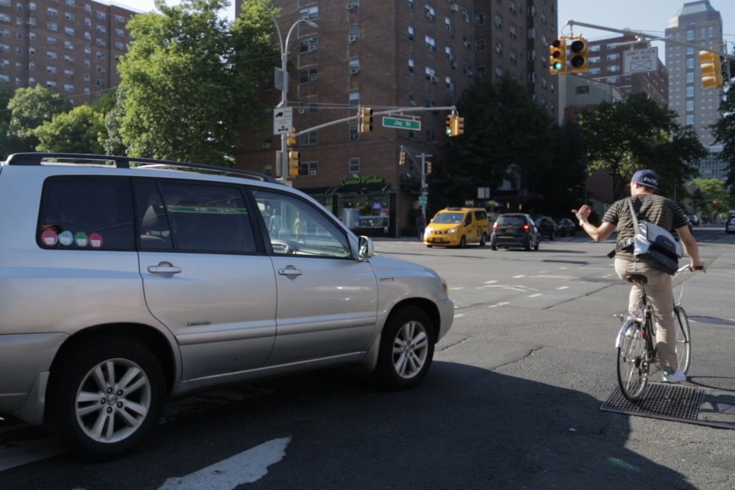 Slap a car while biking if a driver comes too close, it's fine.