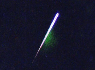 Video shows two meteors burning up as seen from space.