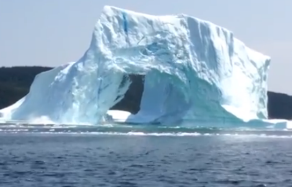 Iceberg collapse: Video captures structure falling into sea.
