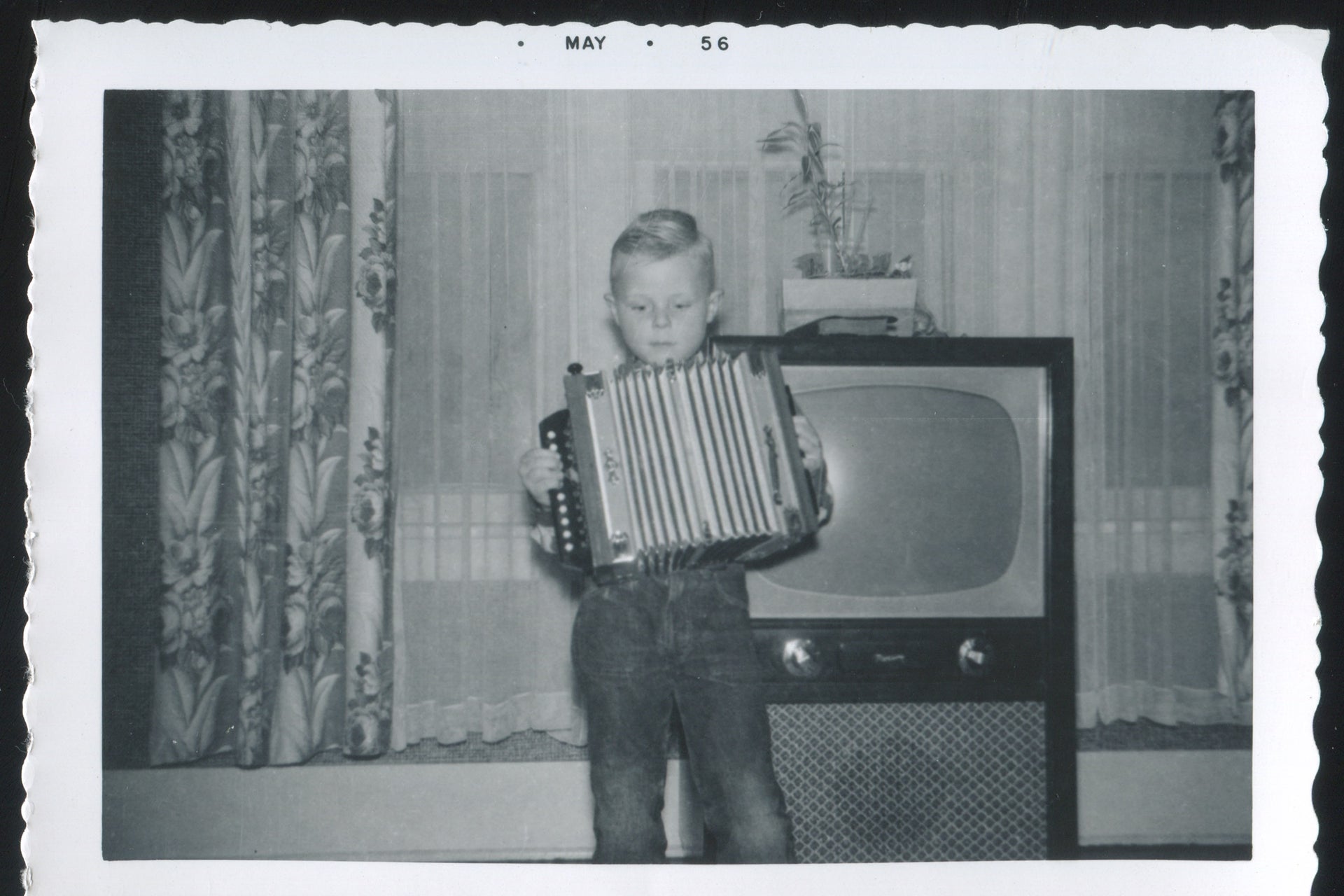 Vintage snapshots of people with their TVs: Lynn Spigel essay.