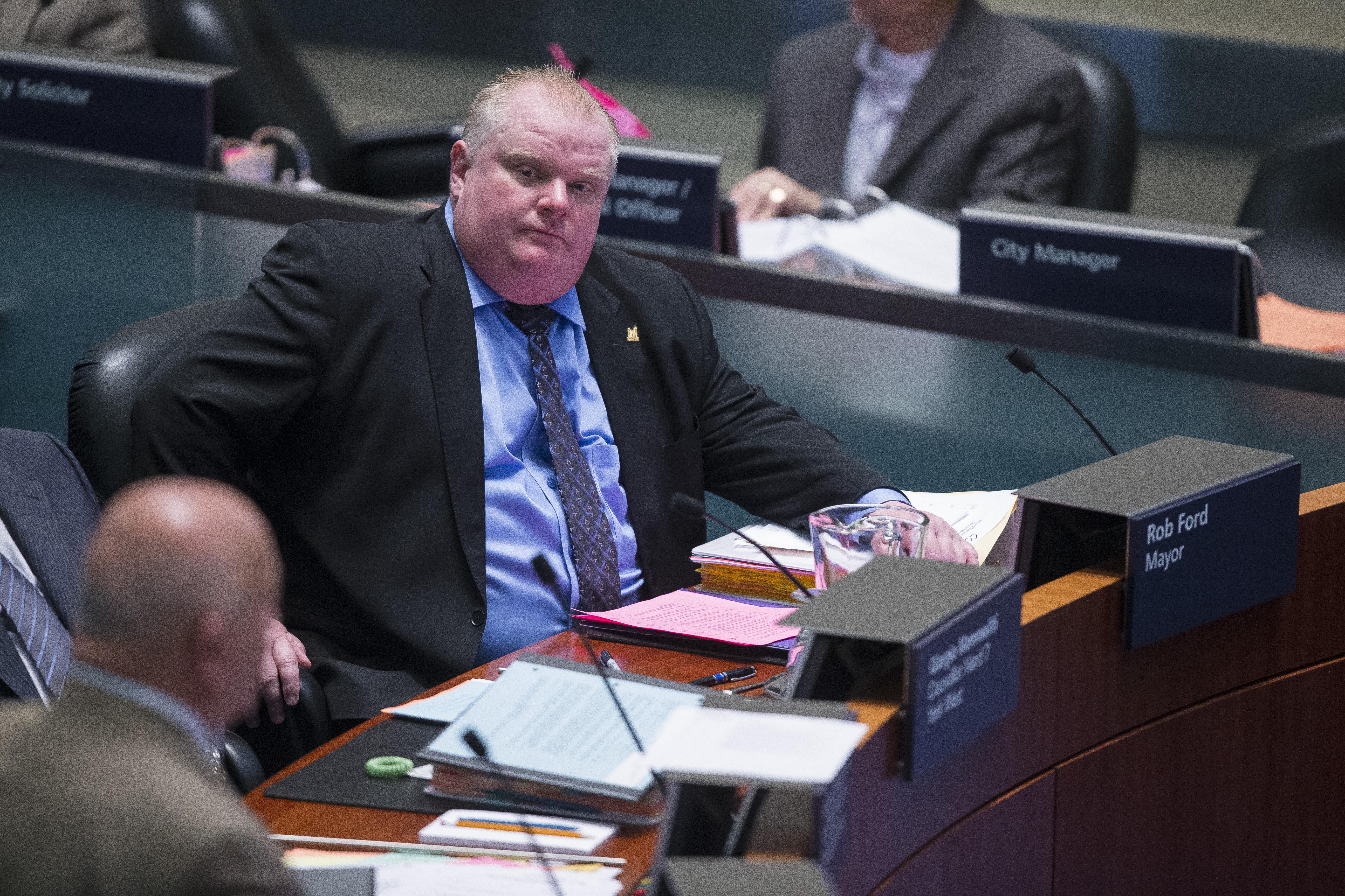The Toronto council strips Rob Ford of mayor’s office authority.