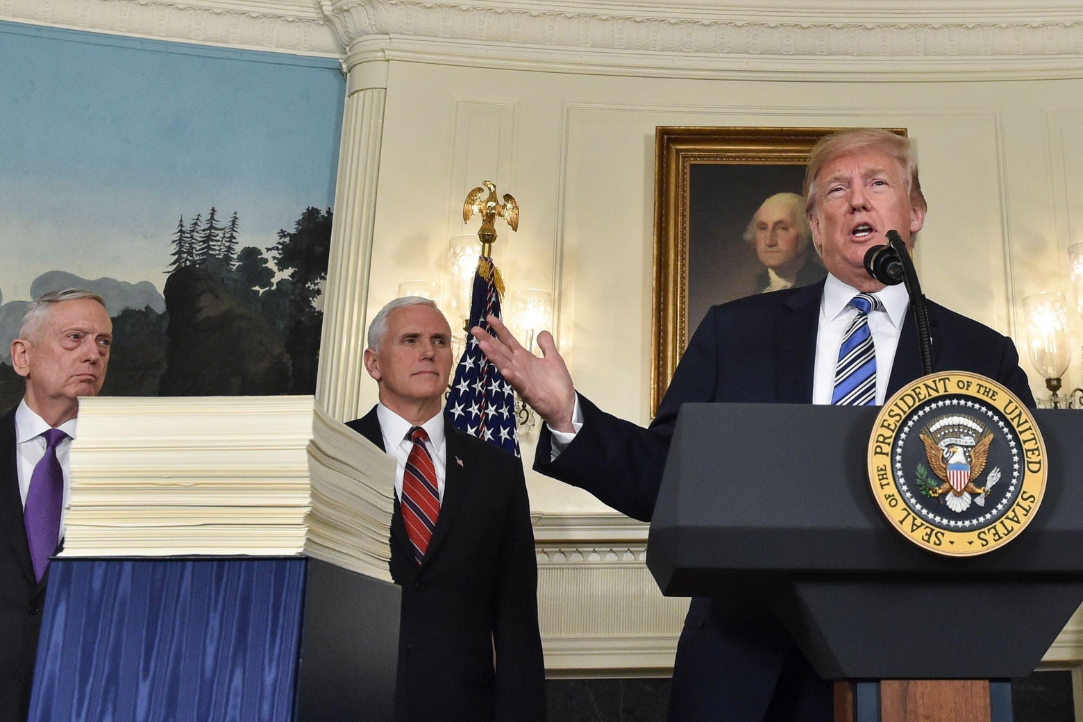 President Trump signs Congress' spending bill into law.