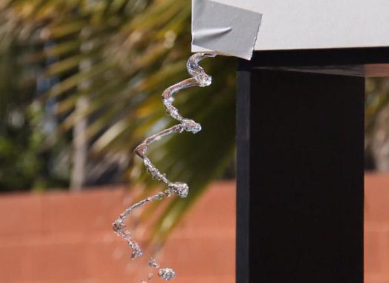 Water spiral: Amazing video of water spiraling out of a hose.