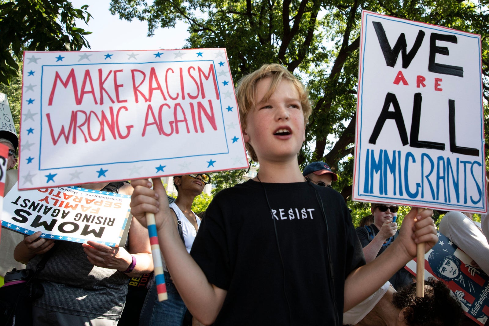 Best signs from the national zero policy immigration protests.