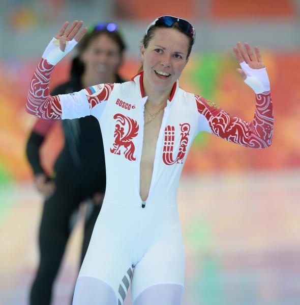 Olga Graf: Russian speed skater unzips suit for accidental striptease.