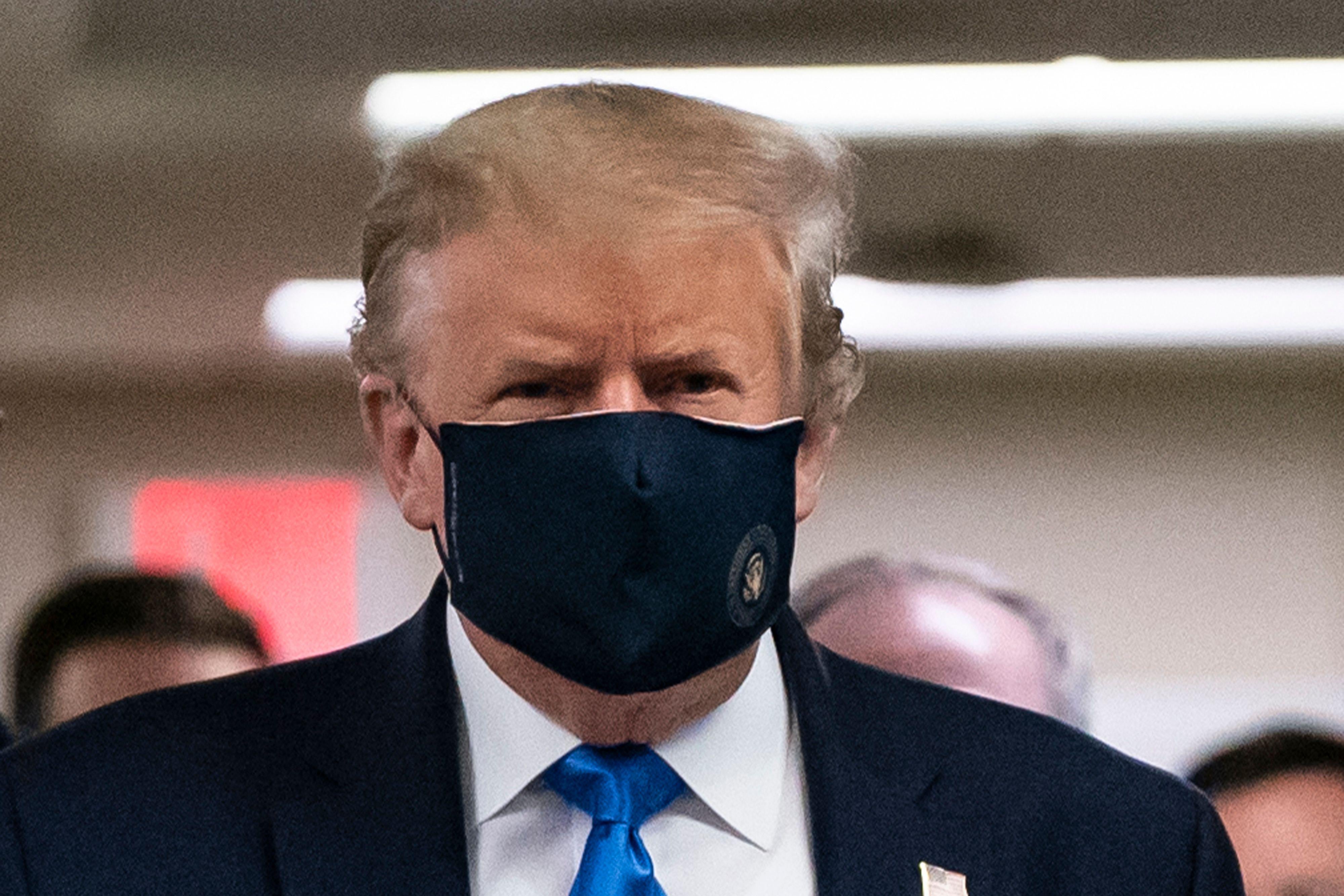 Trump wears face mask in public for first time during coronavirus pandemic.
