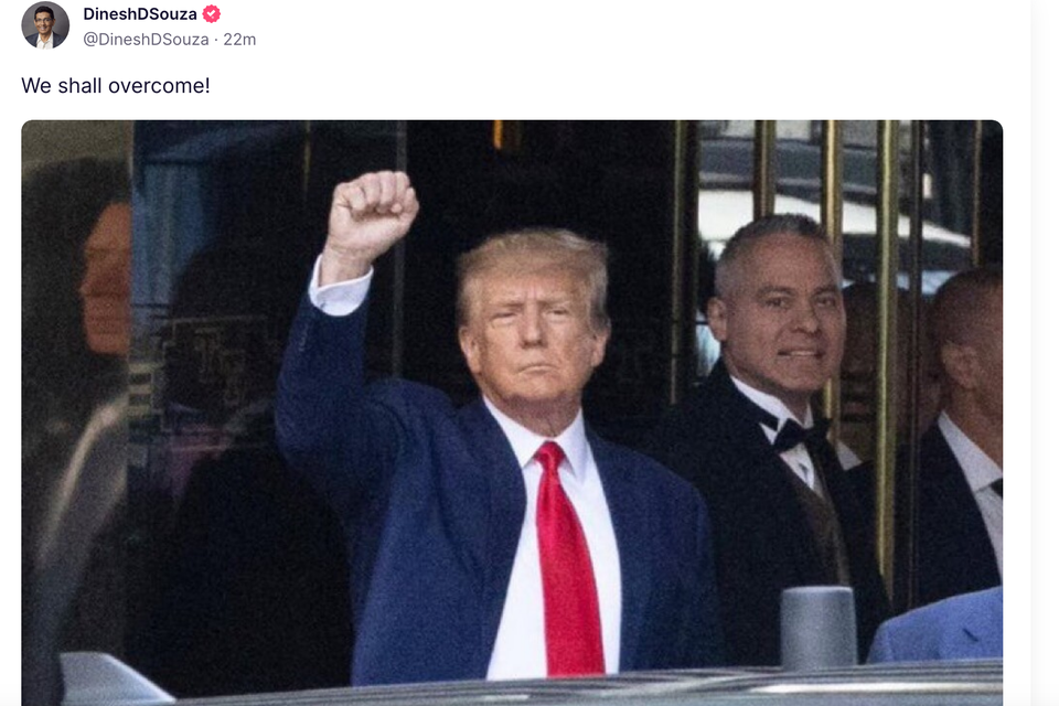 The Trump raised-fist photo from his arraignment was the defiant meme ...