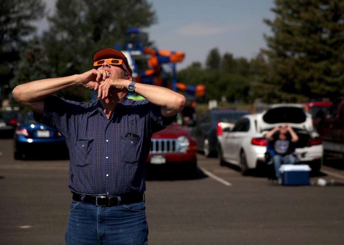 Photos of solar eclipse watchers and eclipse glasses, plates, and ...