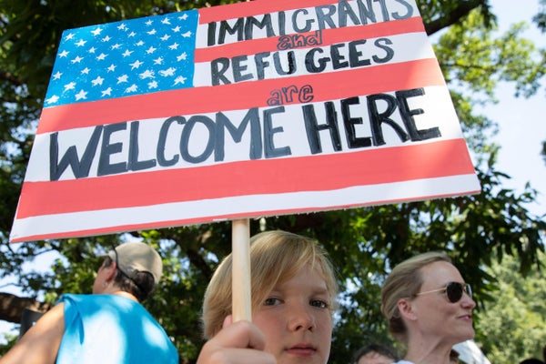 Best signs from the national zero policy immigration protests.