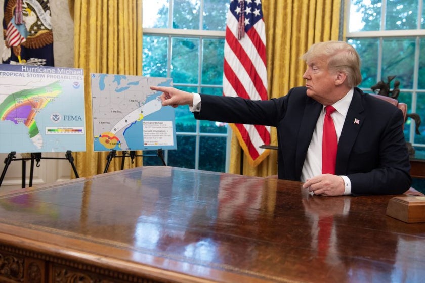 Trump points at map to demonstrate Hurricane Michael preparedness.
