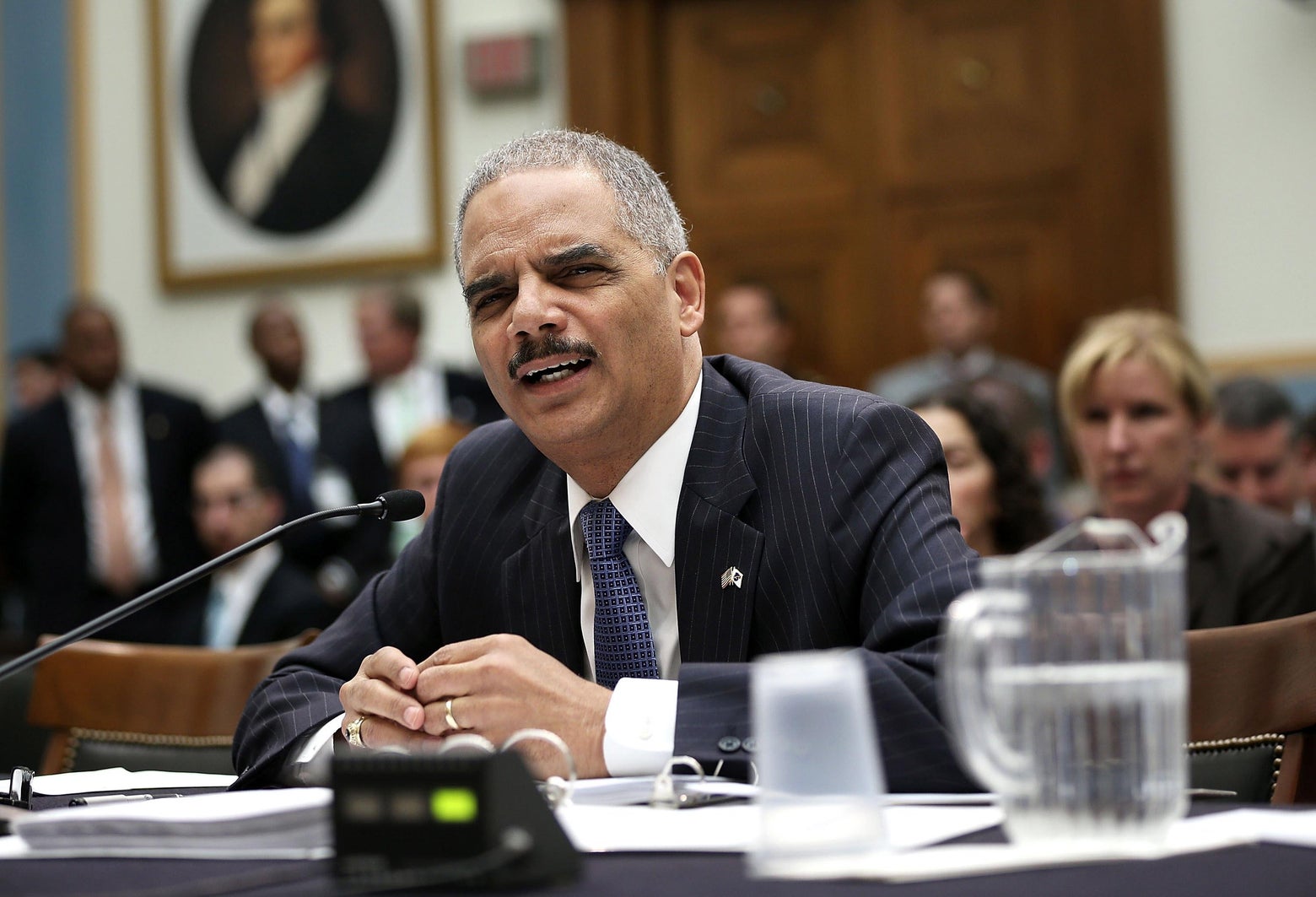 John McCain questions whether Eric Holder should remain attorney general.