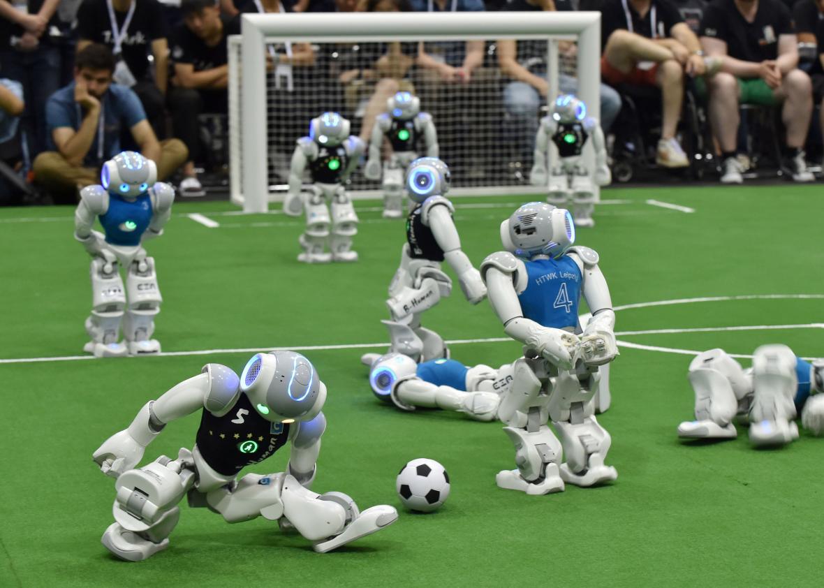 Robot soccer tournament displays robots mediocre soccer skills.