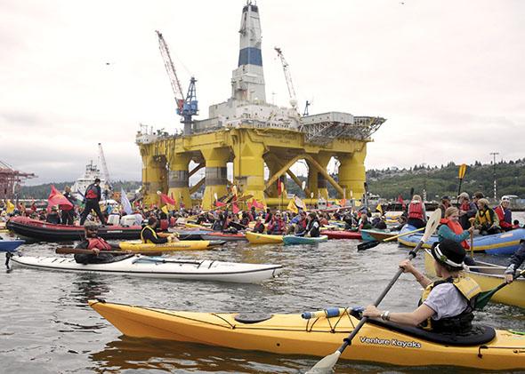 Protest against Shell drilling in the Arctic: Kayaks and boats near ...