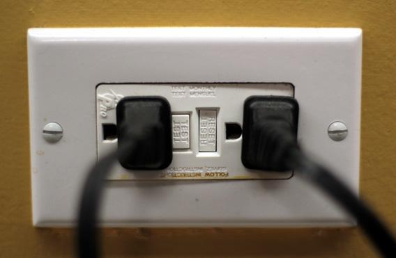 Wall socket buttons: What do the "test" and "reset" outlet buttons do?