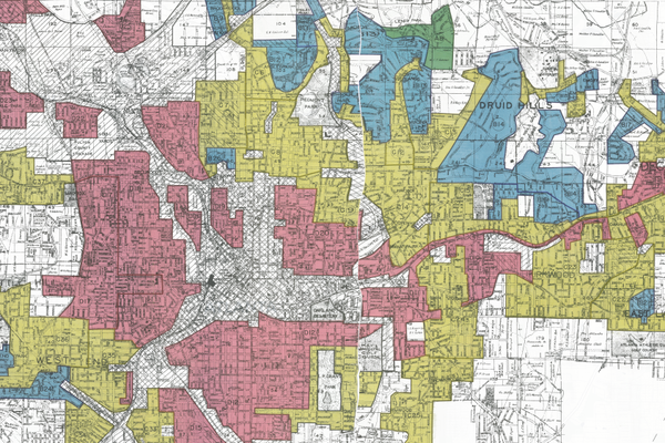 Redlining has taken its toll on property values. But not in every city.