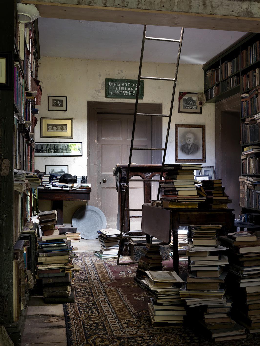 Simon Brown photographs old books in his series, “The Weight of Knowledge.”