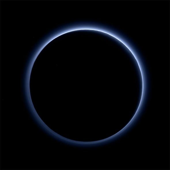 Pluto: New images show sky is very faintly blue.