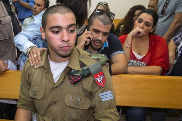 Israeli soldier who shot Palestinian stabbing attacker charged with ...