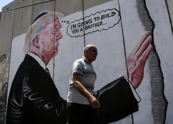 Mural depicting Trump and Netanyahu sharing a kiss pops up on West Bank ...